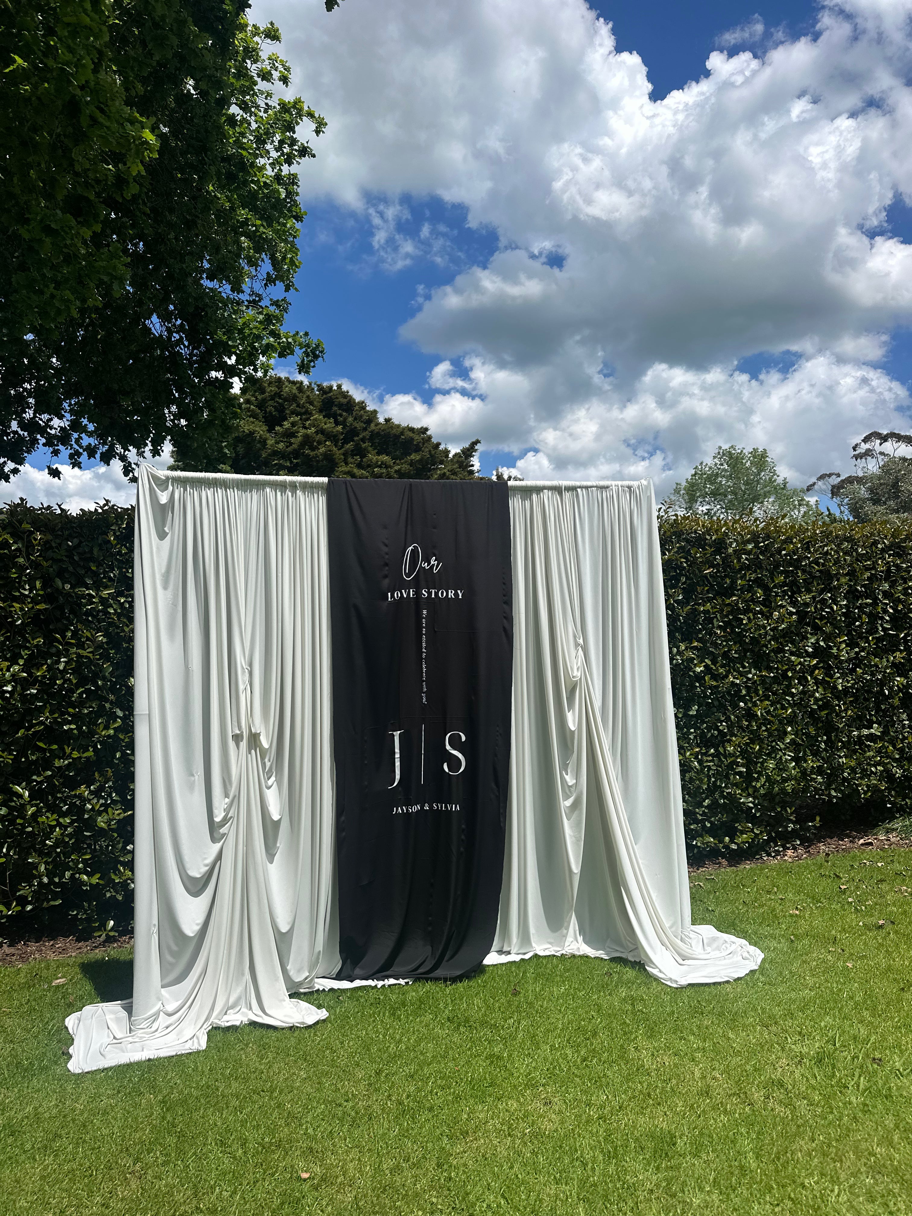 Draped backdrop with customised signage – Bloom & Co
